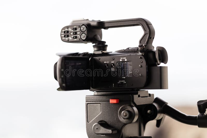 Low End Professional Video Camera on Fluid Head Tripod Stock Image ...