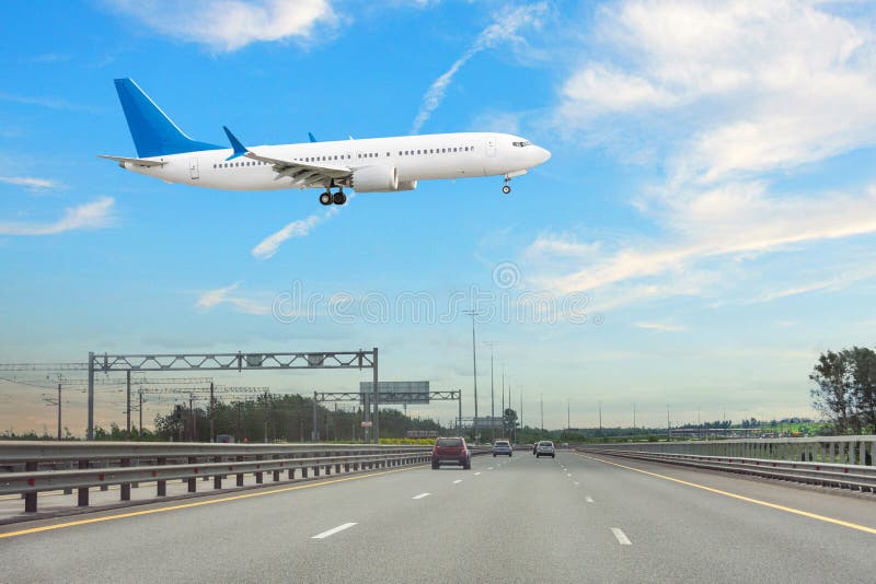 Low-flying Aircraft Over the Expressway before Landing at the Airport ...