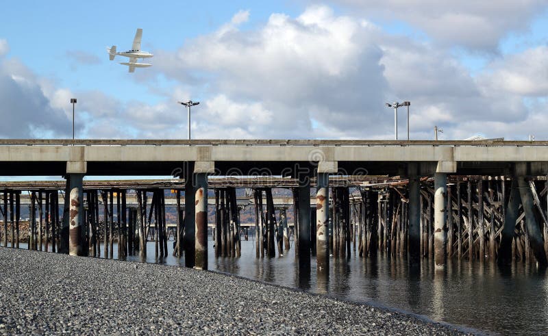 Low Flying Seaplane and Dock Stock Photo - Image of harbor, blue: 21935718