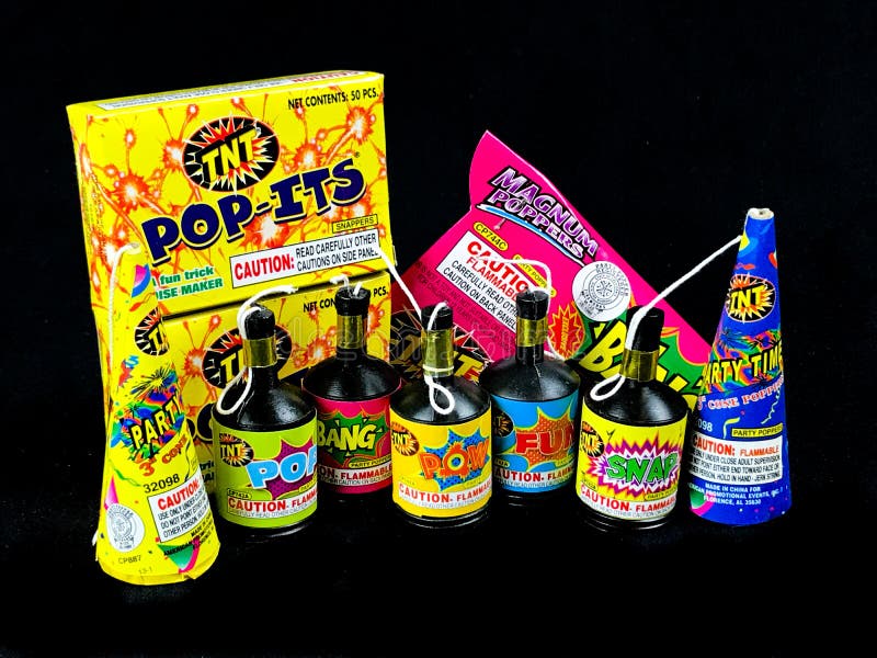 Low Grade Hand Held Fireworks Like Pop Its and Party Poppers on a Black ...