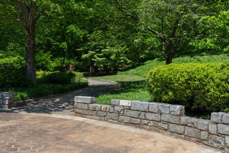 Low Granite Block Wall, Path through an Urban Park in Spring, Green ...