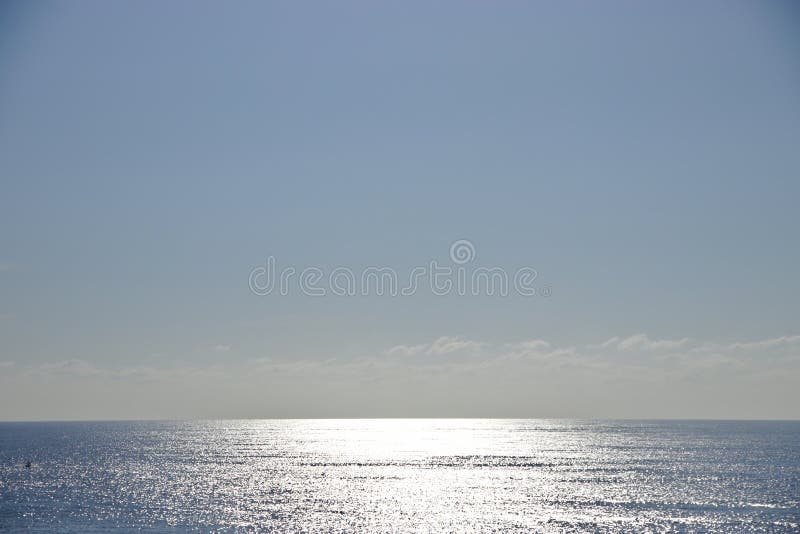 Low Horizon Over the Ocean with Reflections from the Sun Stock Photo ...