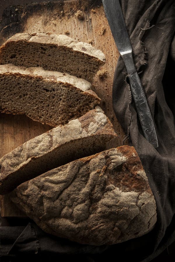 Low Key Food Photography. Black Rustic Bread on Dark Background Stock ...