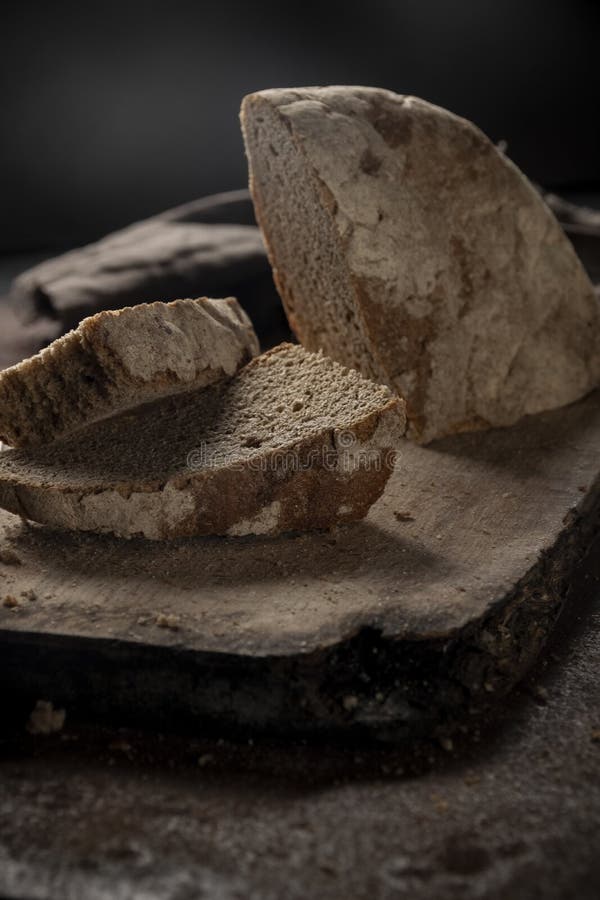 Low Key Food Photography. Black Rustic Bread on Dark Background Stock ...