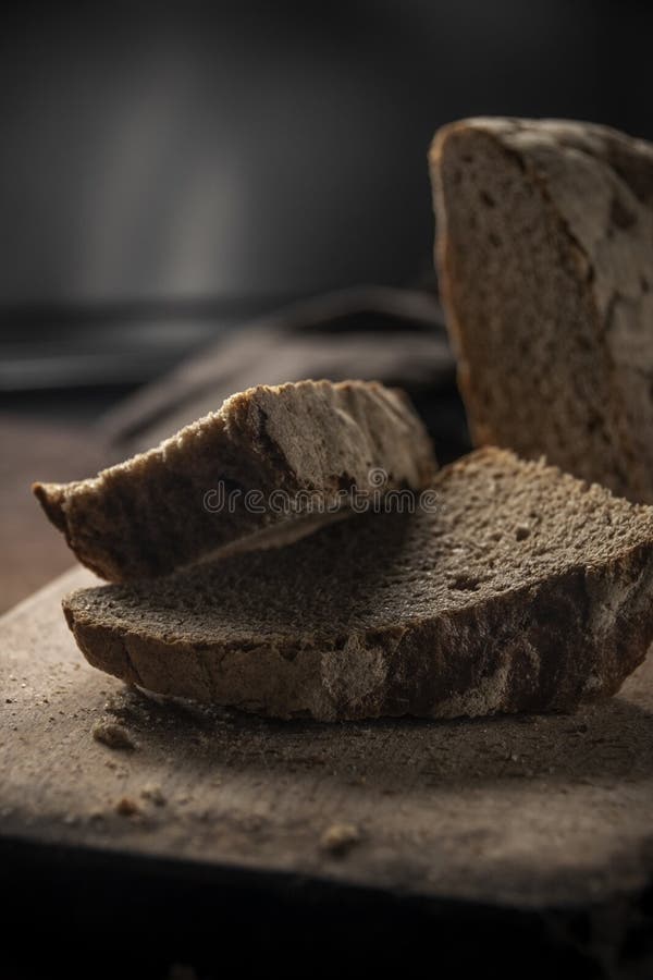 Low Key Food Photography. Black Rustic Bread on Dark Background Stock ...