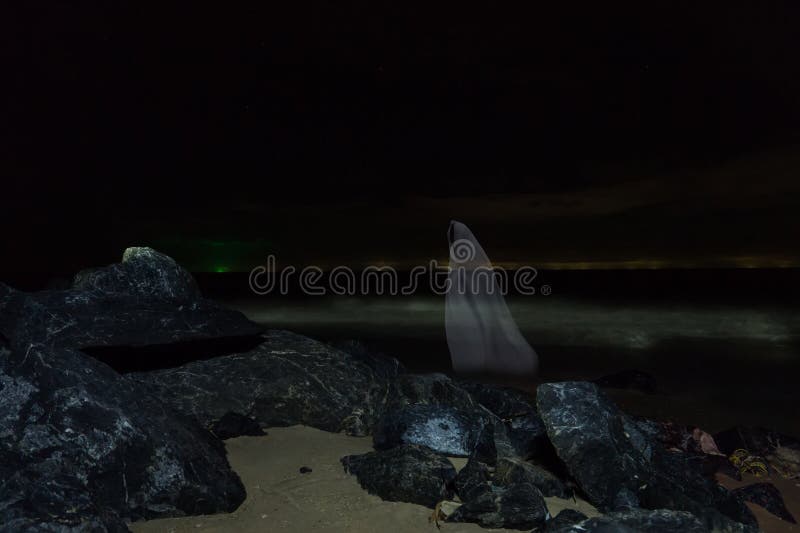 Low Key Image a Blur White Ghost on the Beach Stock Photo - Image of ...