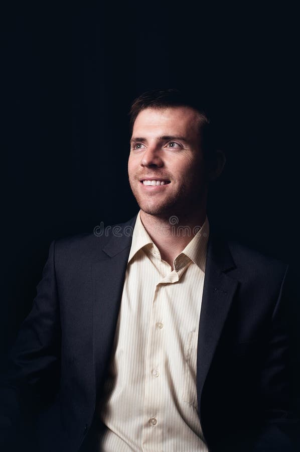 Low-key Portrait of a Smiling Business Man Stock Photo - Image of ...