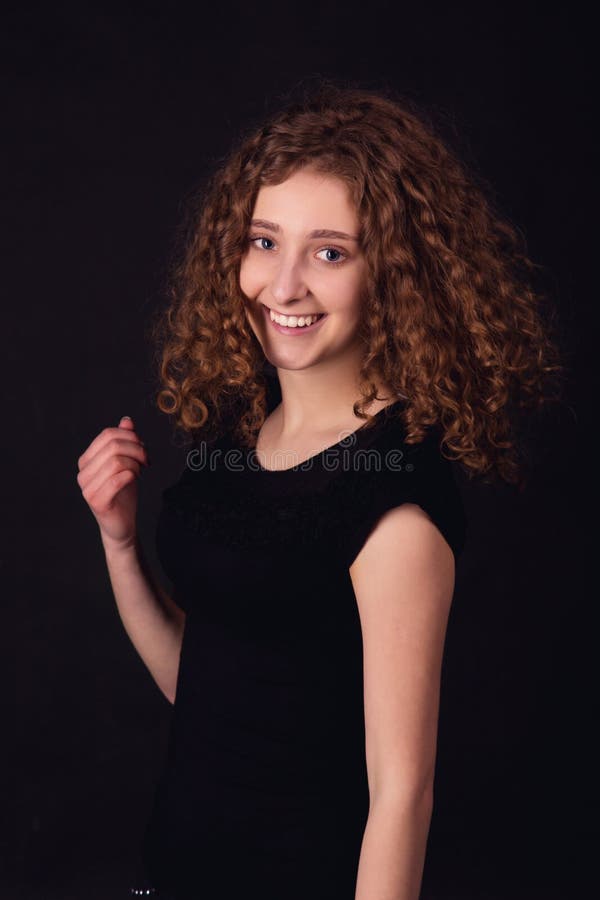 Low Key Shot of a Smiling Young Woman Stock Photo - Image of black ...
