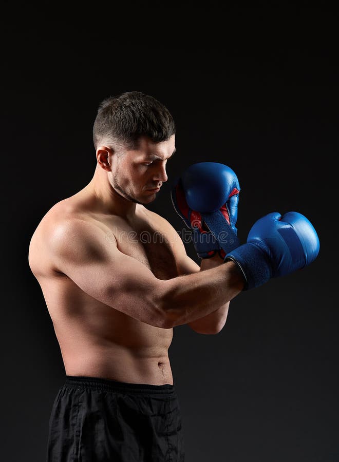 Low Key Studio Portrait of Handsome Muscular Fighter Practicing Boxing ...