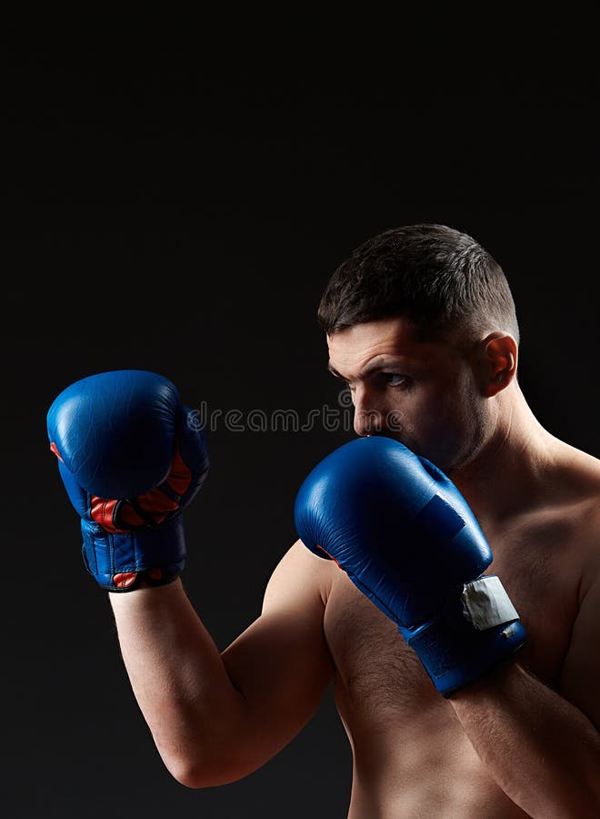 Portrait of Young Boxer Fighter with Boxing Gloves Against Wooden Wall ...
