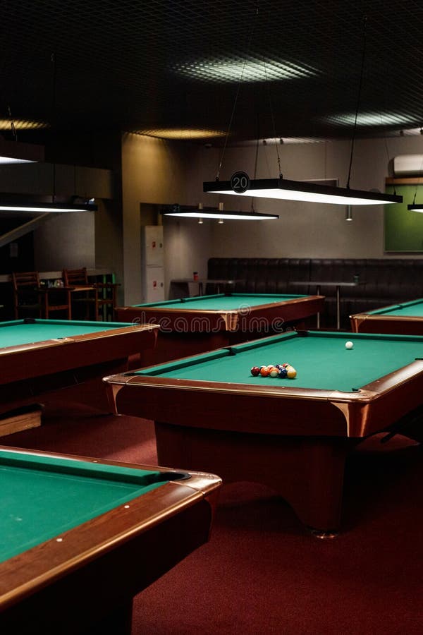 Low Lit Pool Club with Several Billiard Tables Stock Photo - Image of ...