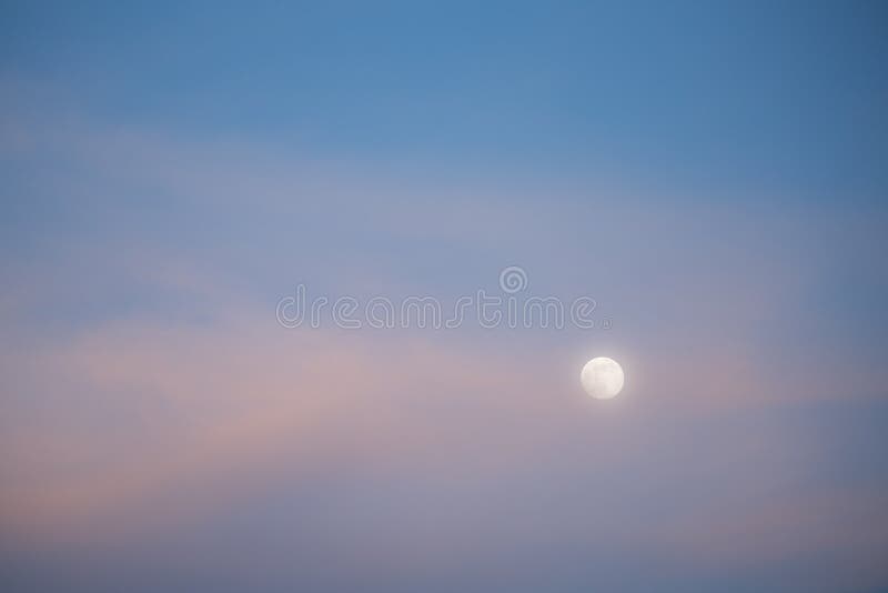 Low Moon and Clouds in Evening Light Stock Image - Image of moon ...