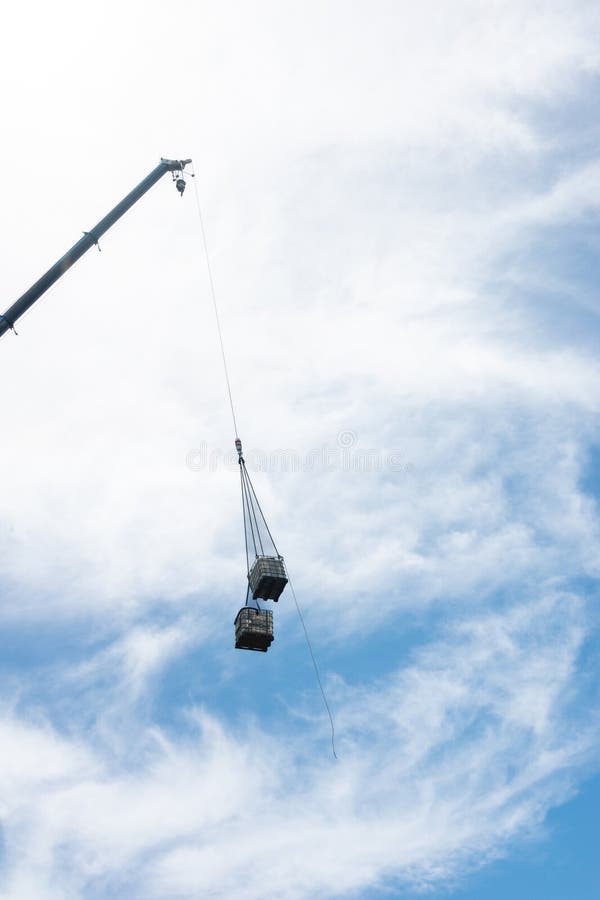 Low Point of View of Crane Lifting Load High into Sky Stock Image ...