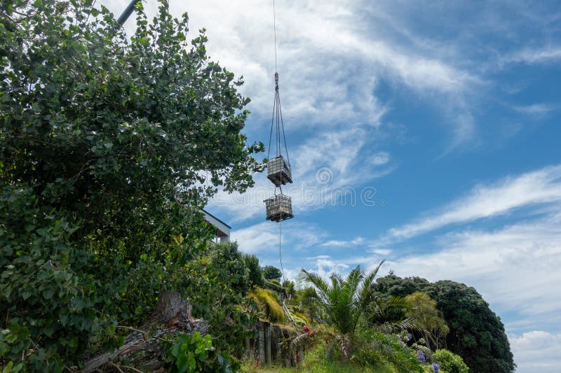 Low Point of View of Crane Lifting Load High into Sky Stock Photo ...