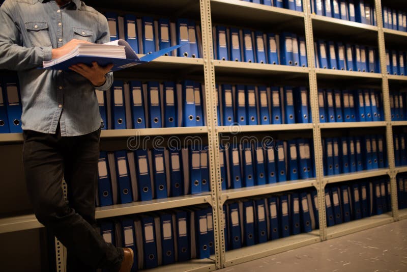 Documents Scattered by Fallen Businessman in File Storage Room Stock ...