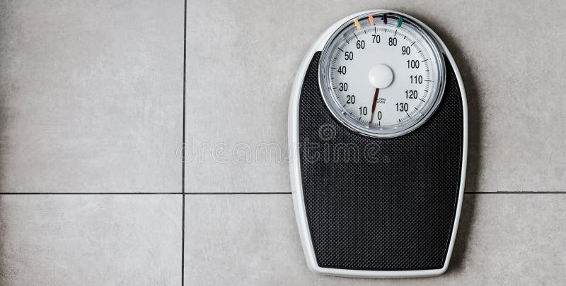 Low Section of Man Standing on Weight Scale Stock Photo - Image of ...