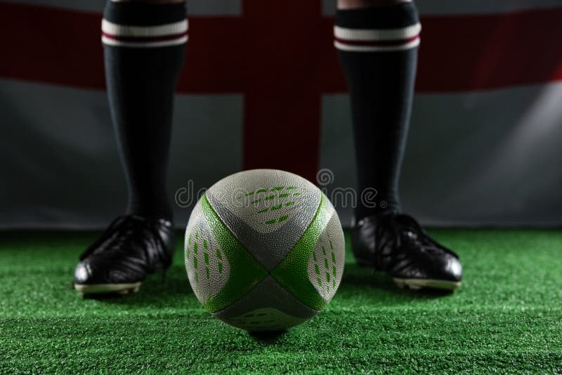 Low Section of Rugby Player Standing Against British Flag Stock Photo ...