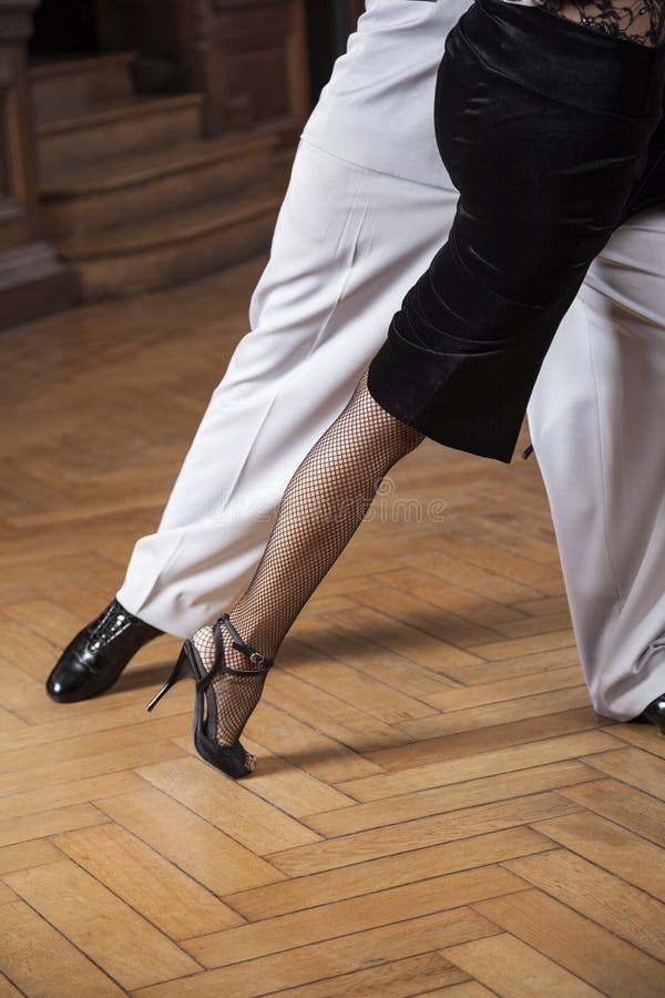 Low Section of Tango Dancers Performing on Hardwood Floor Stock Photo ...