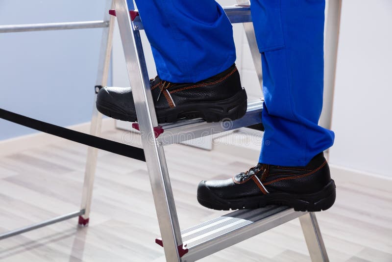 Handyman Climbing Ladder stock image. Image of climbing - 210436325