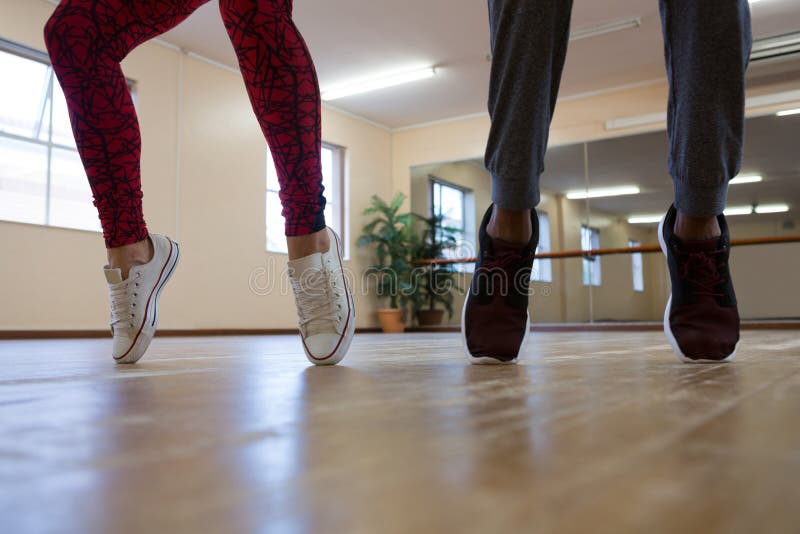 Low Section of Woman with Friend Practicing Dance Stock Image - Image ...