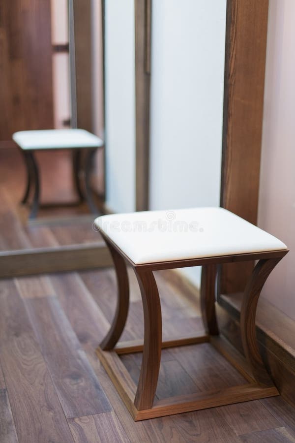 Low Square Stool with a Padded Seat in a Modern Interior Stock Photo ...