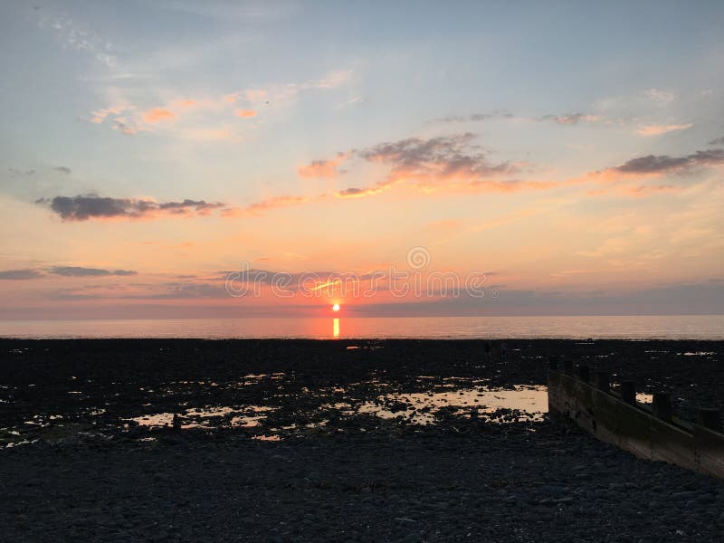 Low sunset stock image. Image of beach, calm, summer - 220302191