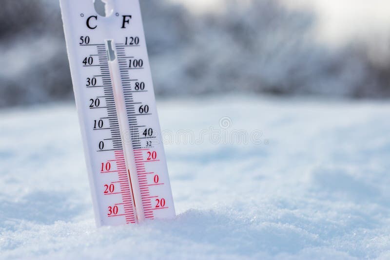 Low Temperature Thermometer in the Snow in Celsius or Fahrenheit Stock ...