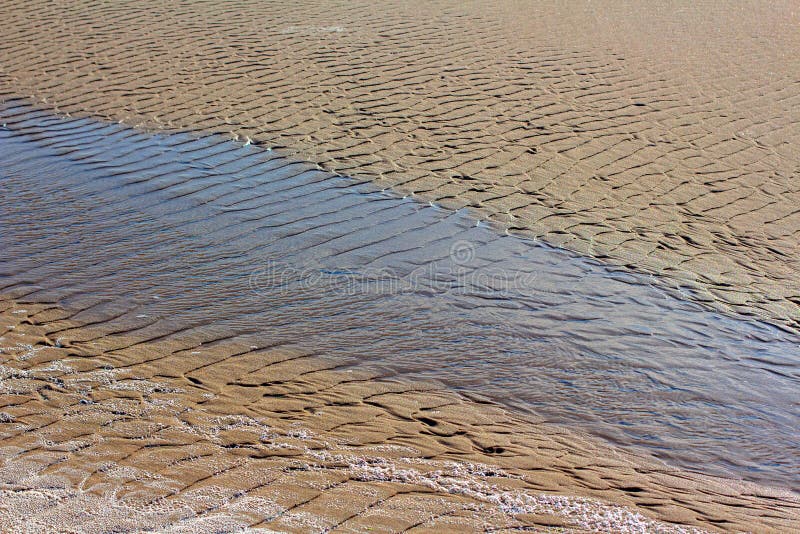Low Tide and Streaming Water in Golden Sand Beach in Sable D`or on a ...