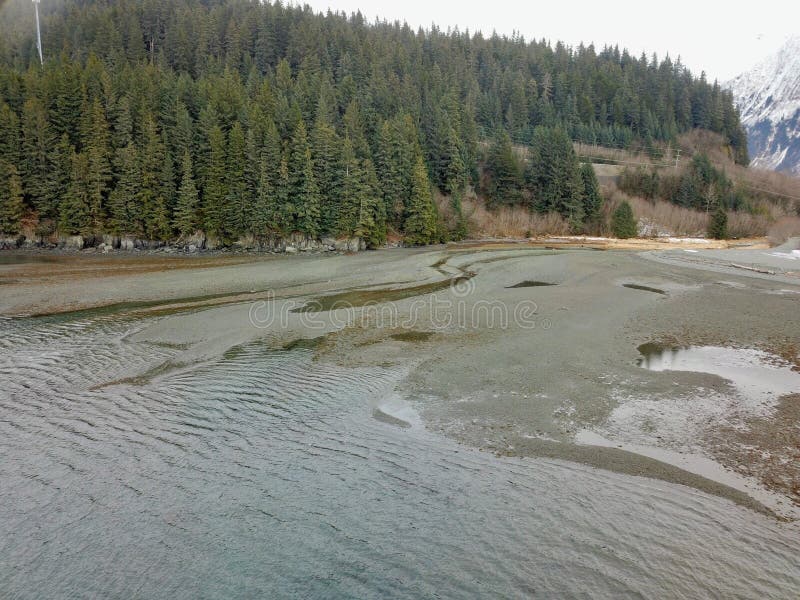Low tide on Alaskan stream stock photo. Image of tide - 138386960