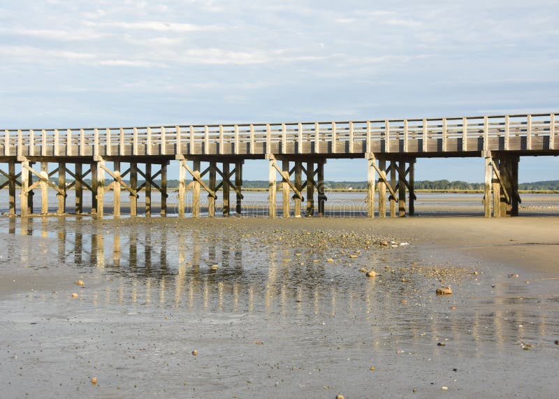 Low Tide with a Wood Bridge Extending Over the Bay Stock Image - Image ...