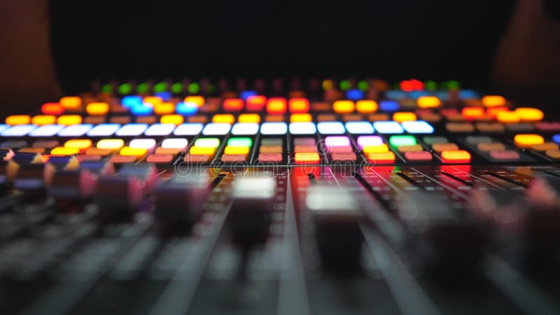 Close Up of Dj Remote or Soundboard with Moving Buttons and Brightly ...