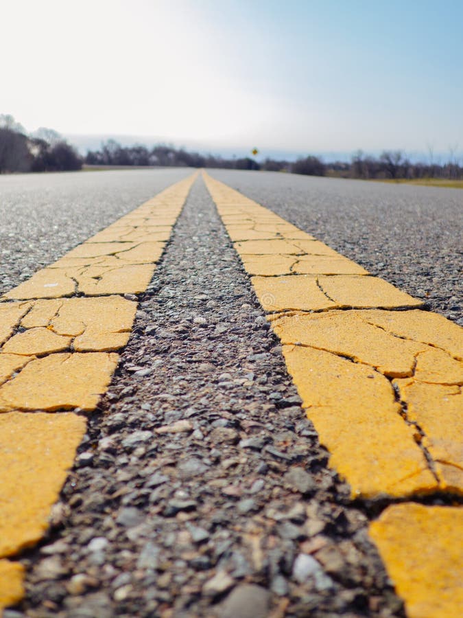 Solid Yellow Line Down the Center of a Paved Road. Stock Photo - Image ...