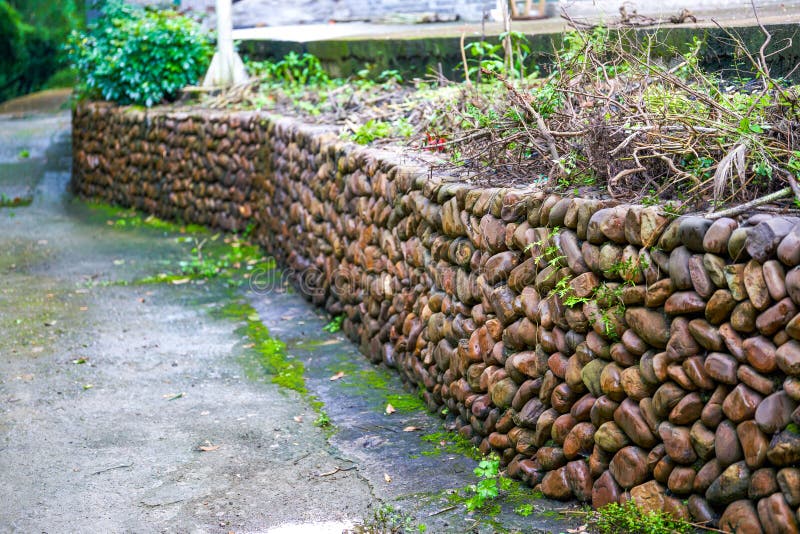 A Low Wall Made of Stacked Stones in the Chinese Countryside Stock ...