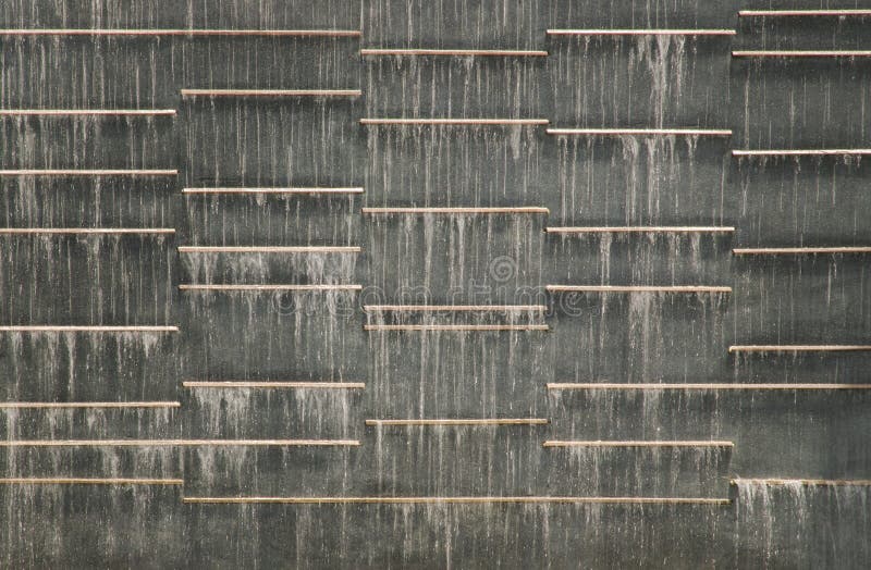 A Low Waterfall Flowing through Black Stone Slabs. for Background or ...