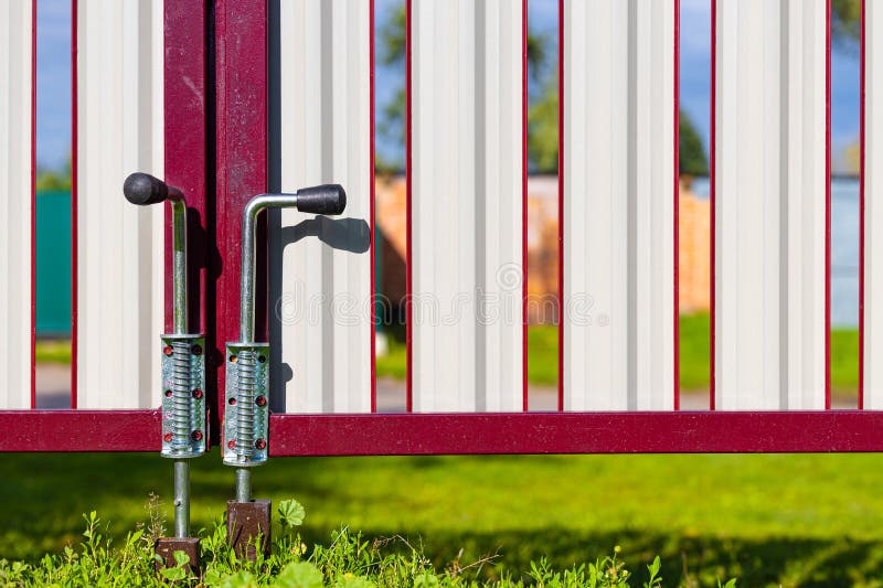 Lower Deadbolt on Metal Gates in the Yard Stock Photo - Image of ...