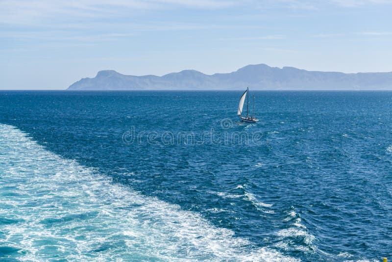 Marine Composition with Blue Shades of Large Wake, Small Sailboat and ...