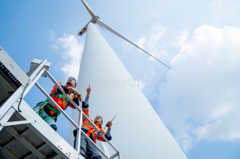 Lower View of Two Engineers or Technician Workers Stand on Base of Big ...