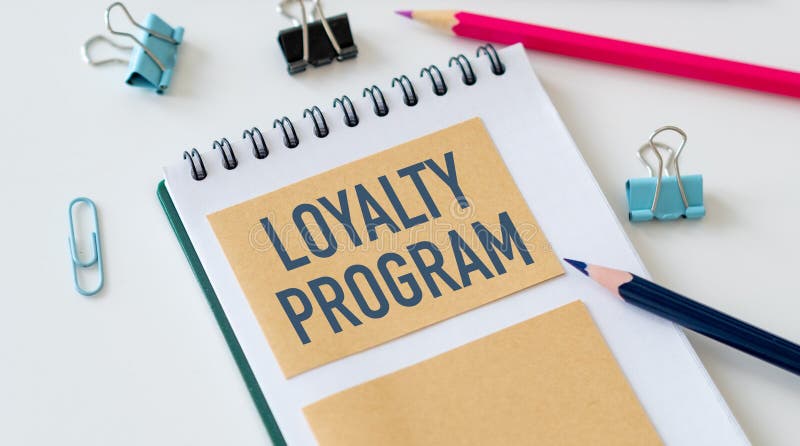 LOYALTY PROGRAM Text Written on a Notebook on the White Table. Stock ...
