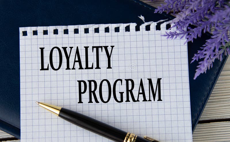 LOYALTY PROGRAM - Words on a White Sheet with a Black Notepad and Pen ...