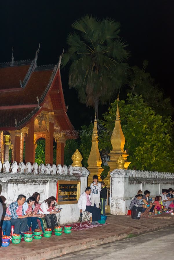 LUANG PRABANG, LAOS - JANUARY 11, 2017: Feeding the Monks. the Ritual ...