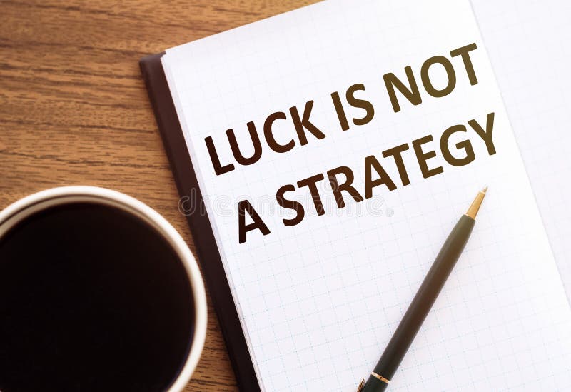 LUCK is NOT a STRATEGY - Text on Notepad on Wooden Desk Stock Photo ...