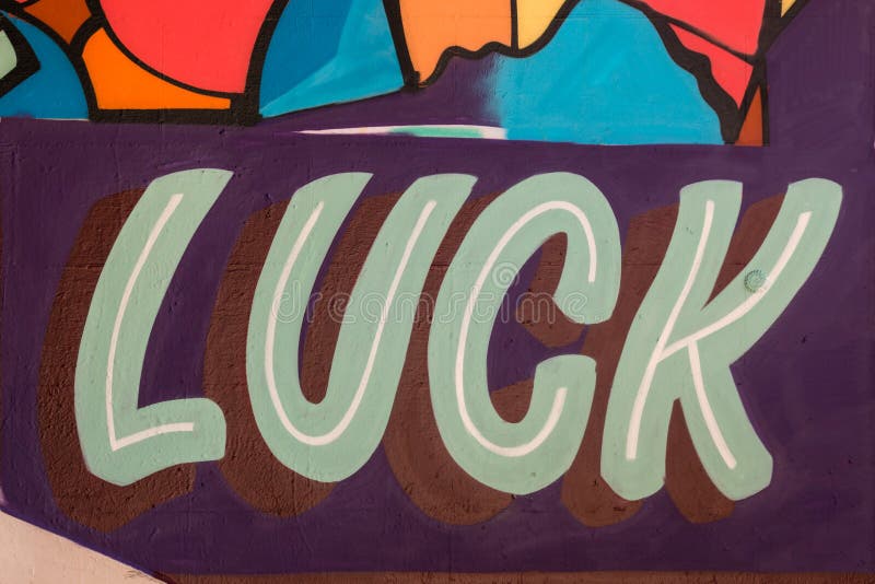Luck painted on the wall stock photo. Image of colors - 53562440