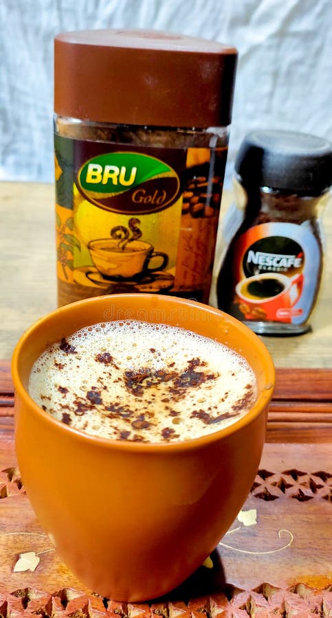 A Cup of Coffee with Milk Served on the Table Editorial Image - Image ...