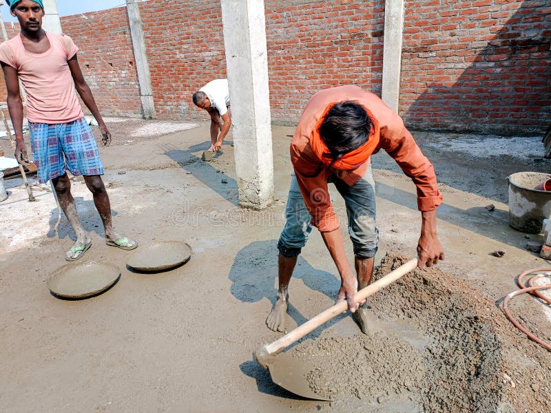 Indian Workers Doing Construction Work Manually on Floor Using a Shovel ...