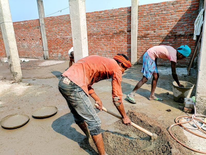 Indian Workers Doing Construction Work Manually on Floor Using a Shovel ...
