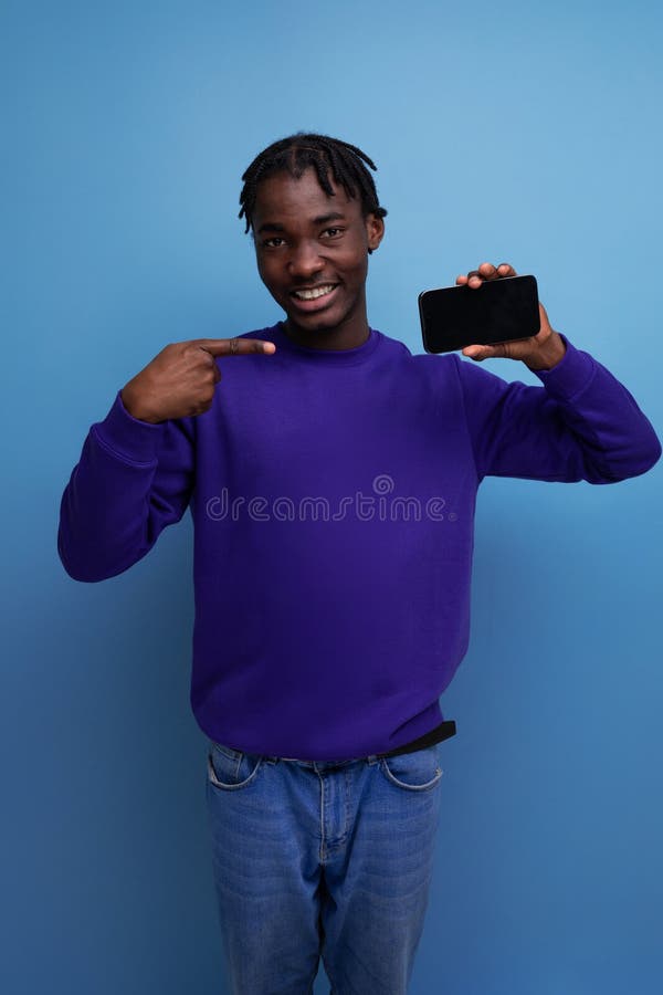 Lucky Winner African Young Man with Dreadlocks with Phone on Studio ...