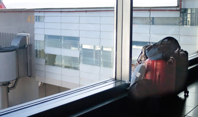 Luggage Next To an Airport Window Waiting To Be Checked in on the Next ...