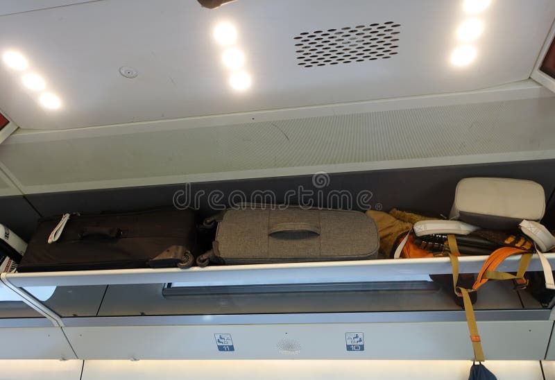 Luggage Placed in the Compartments Above the Seats in a Train. Stock ...