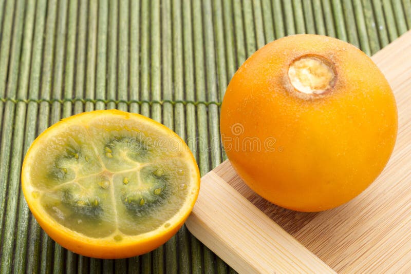 Lulo Tropical Fruit Solanum Quitoense Stock Photo - Image of wooden ...