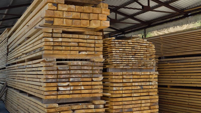 Lumber in a Large Warehouse. Wooden Boards in the Stack Stock Video ...